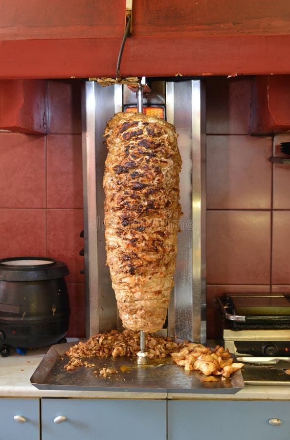 Kebab on a rotating spit stock photo. Image of chicken - 125920862