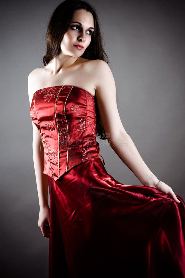 Donna Alla Moda in Un Corsetto Rosso Fotografia Stock - Immagine di ...