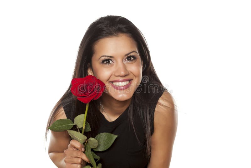 Donna con una rosa fotografia stock. Immagine di giorno - 75510864