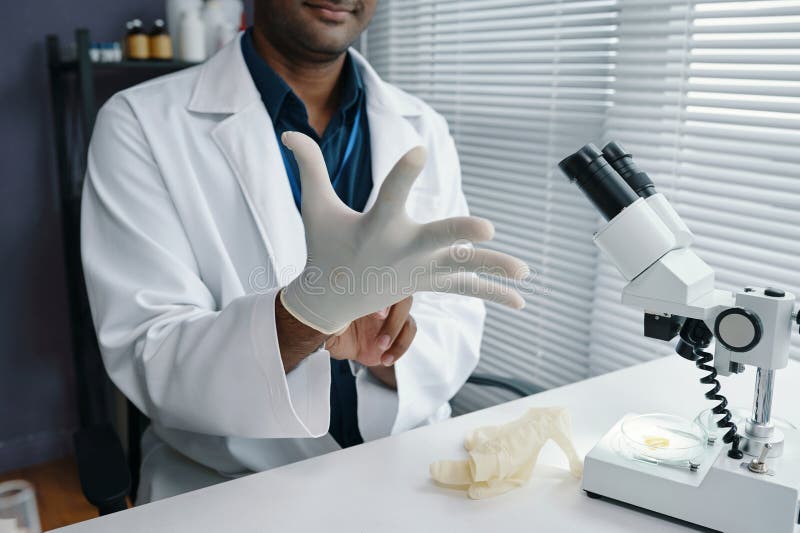 Donning Gloves in Laboratory while Preparing Equipment Stock Image ...