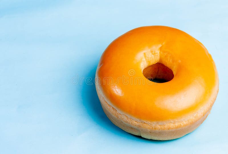 Donut Bread on a Blue Background Stock Image - Image of blue, hole ...