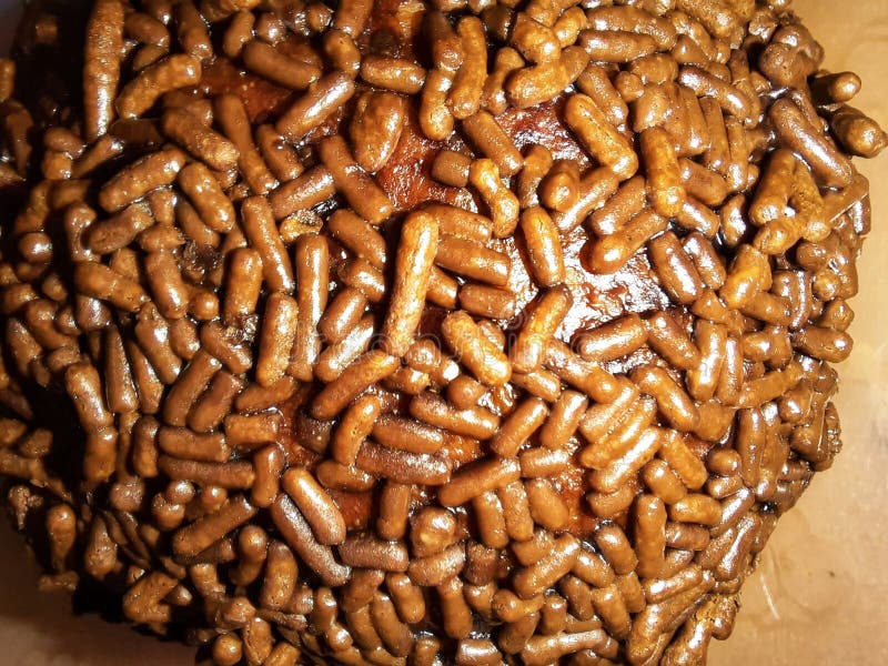 A Donut with Chocolate Meses Topping on it Stock Photo - Image of wood ...