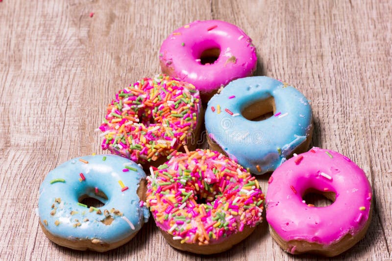 Donut Many Colors are Available on Wooden Floors Stock Image - Image of ...