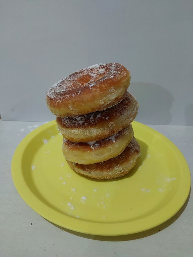 Donut Tower with Powdered Sugar Topping Stock Photo - Image of powde ...