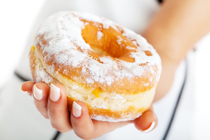 Donut in woman s hand stock image. Image of beautiful - 58497409