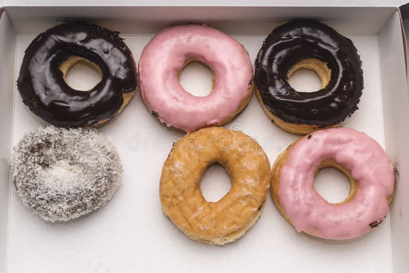 Donuts in a box stock photo. Image of bakery, brown, sprinkles - 46590972
