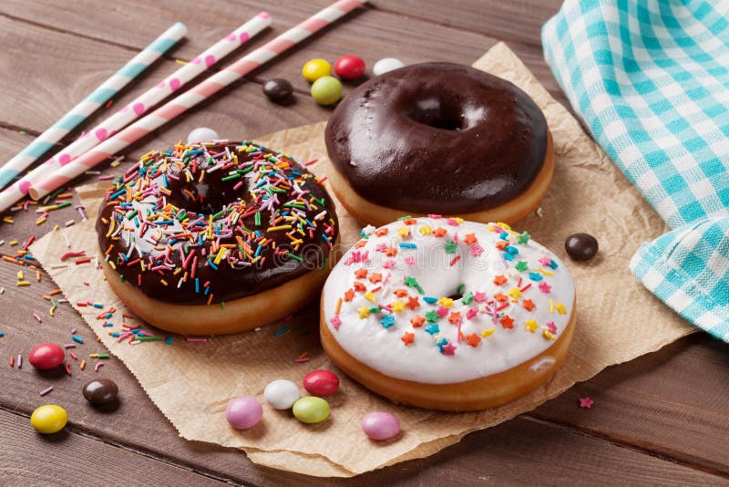 Donuts and candies stock image. Image of donut, table - 68581227