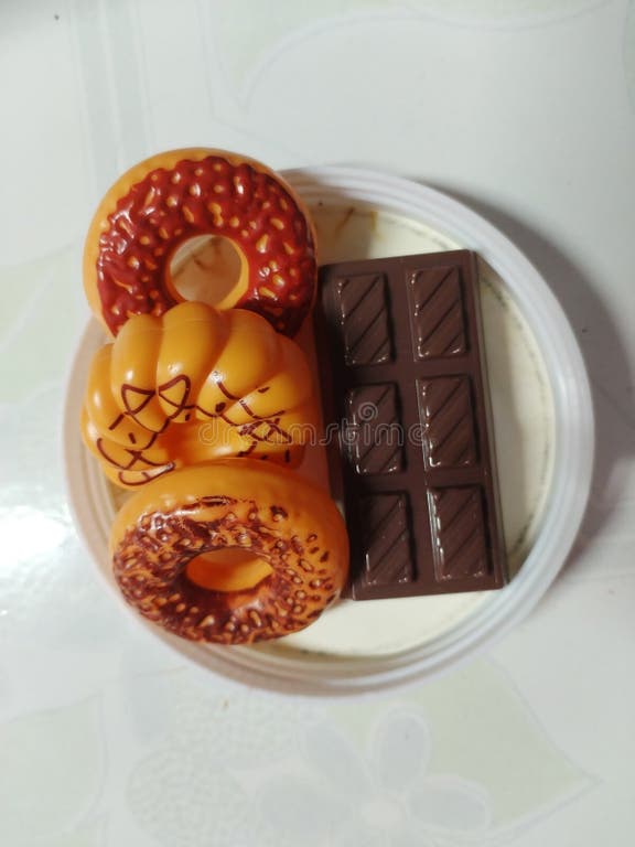 Donuts and Chocolate Bars are a Delicious Array of Toys Stock Photo ...