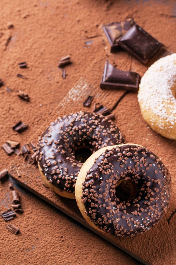 Donuts with Cocoa Powder and Chocolate Stock Photo - Image of baked ...