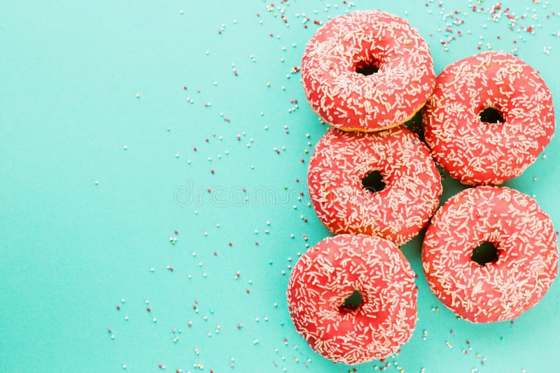 Donuts Decorated with Icing on Blue Background Stock Photo - Image of ...
