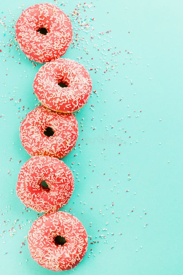 Donuts Decorated with Icing on Blue Background Stock Photo - Image of ...
