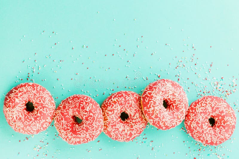 Donuts Decorated with Icing on Blue Background Stock Photo - Image of ...