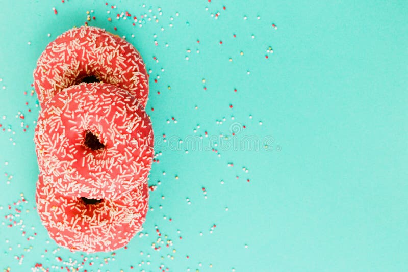 Donuts Decorated with Icing on Blue Background Stock Image - Image of ...