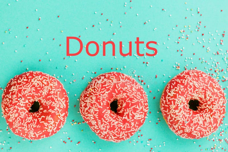 Donuts Decorated with Icing on Blue Background Stock Image - Image of ...