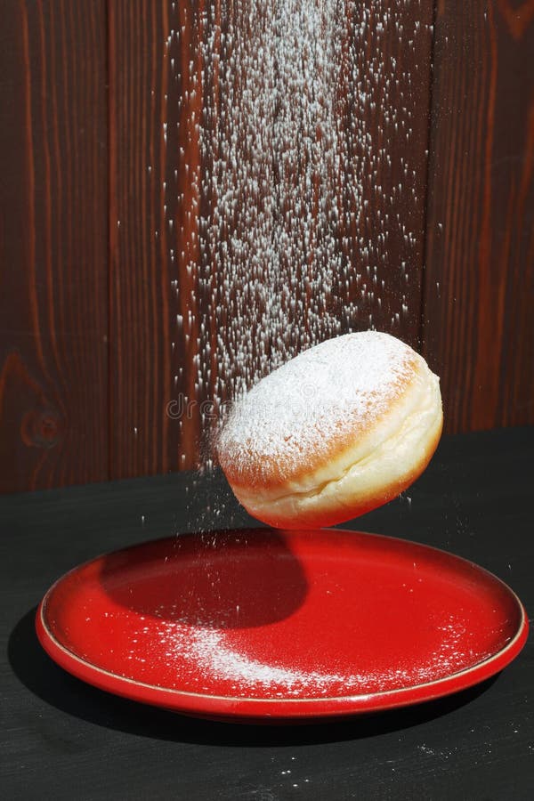 Donuts falling on a plate stock image. Image of cake - 210828065