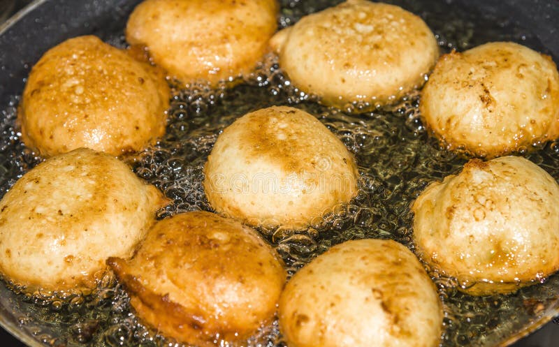 Donuts Frying in Deep Fat. Preparation of Traditional Donuts Stock ...