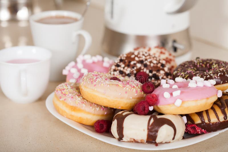 Donuts On Plate On Woode Board With Hot Coffee For Breakfast Stock ...