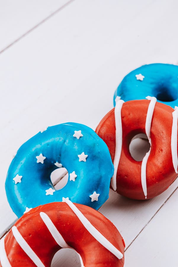 Donuts with Red Icing and White Lines and with Blue Icing and White ...