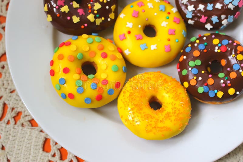 Donuts on a white plate stock image. Image of closeup - 93820931