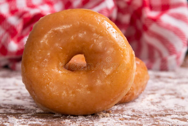 Donuts on wood with flour stock image. Image of collection - 202844253