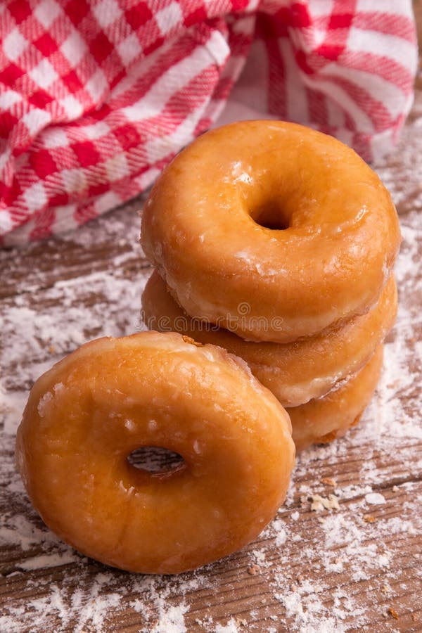 Donuts on wood with flour stock image. Image of icing - 202844301