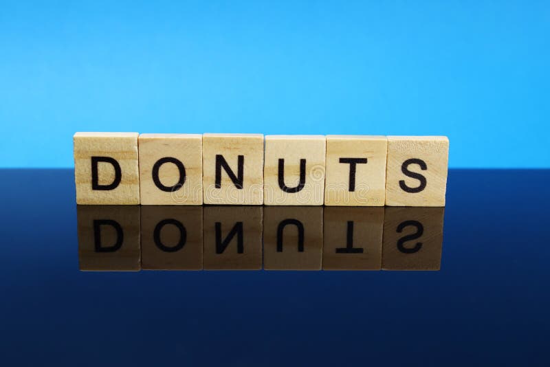 Donuts Word Made of Wooden Letters on a Mirror Surface Stock Photo ...