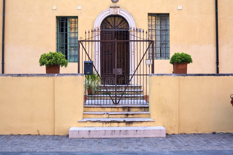 Door Behind a Gate Next To a Staircase in a Square in an Italian Town ...