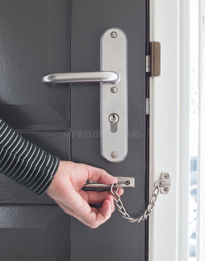 Door chain on a grey door stock image. Image of locked - 90732769