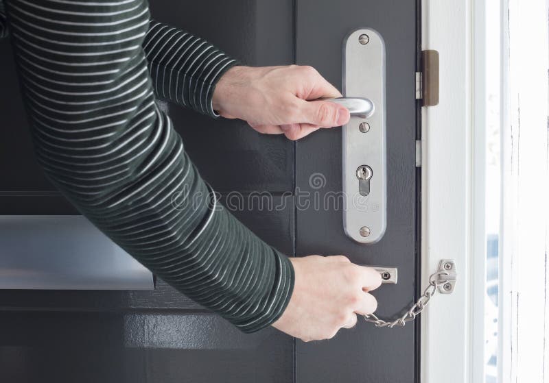 Door chain on a grey door stock image. Image of closely - 90808235