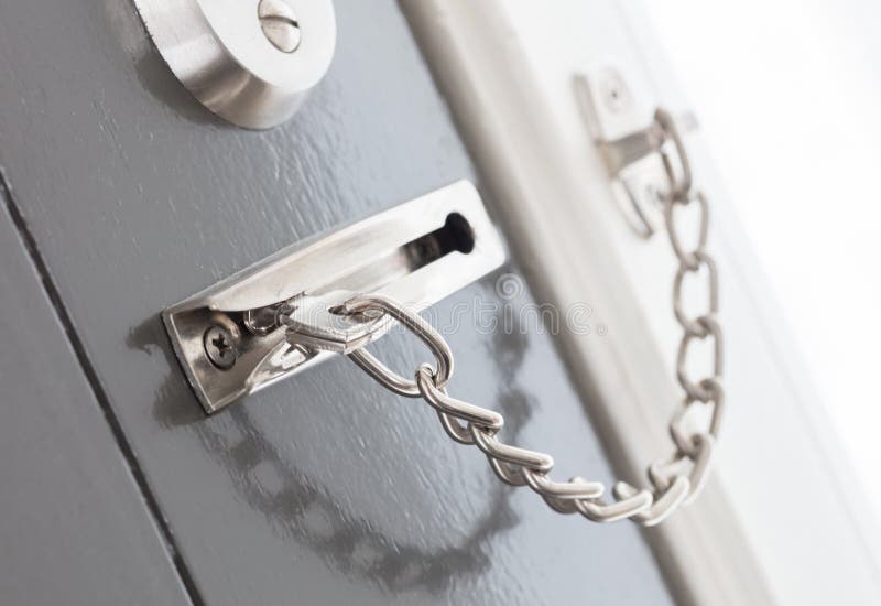 Door chain on a grey door stock photo. Image of safeguard - 91008790