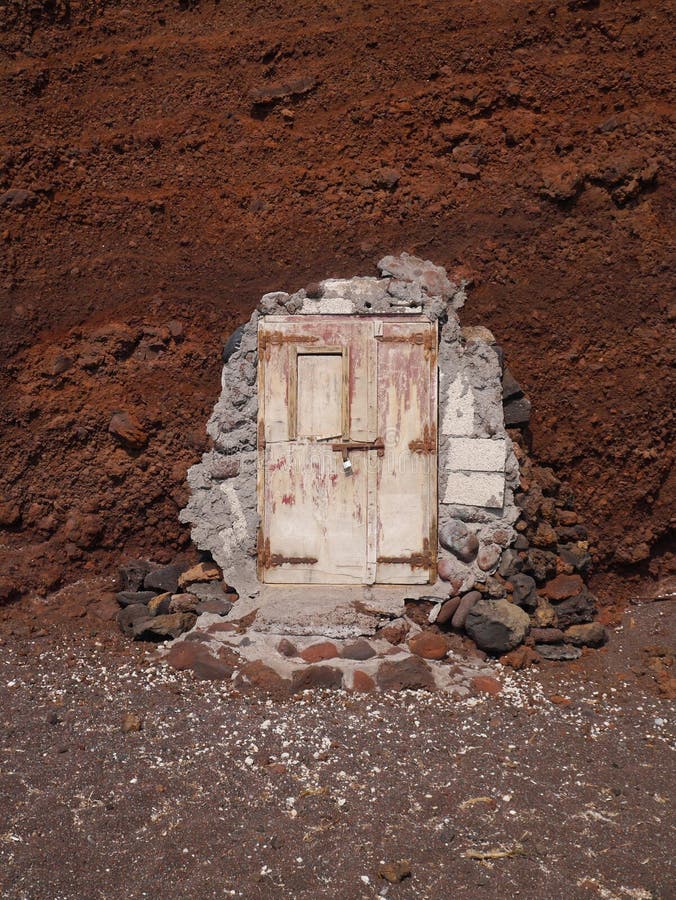 Door at the Cliff of Red Beach, Santorini, Greece. Stock Photo - Image ...