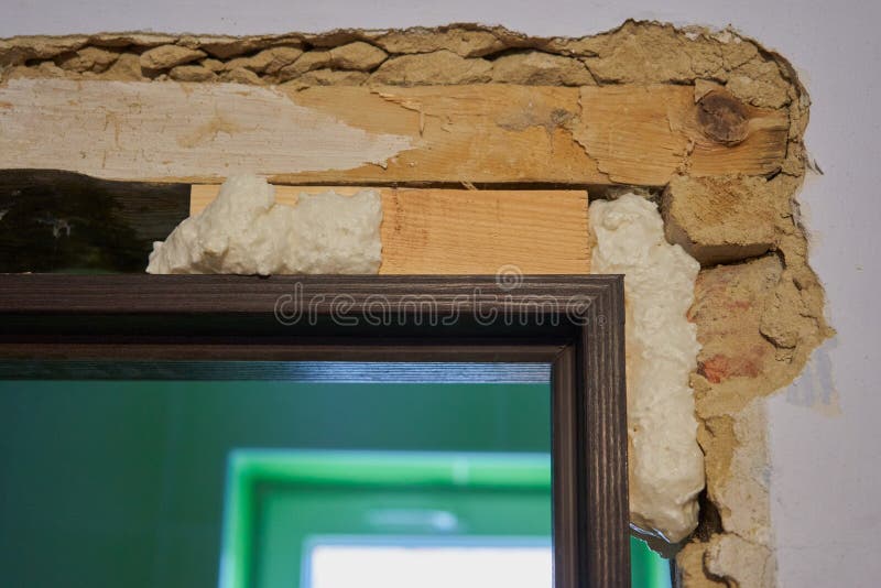 The Door is Foamed with Foam,Polyurethane Foam in the Cracks of the ...