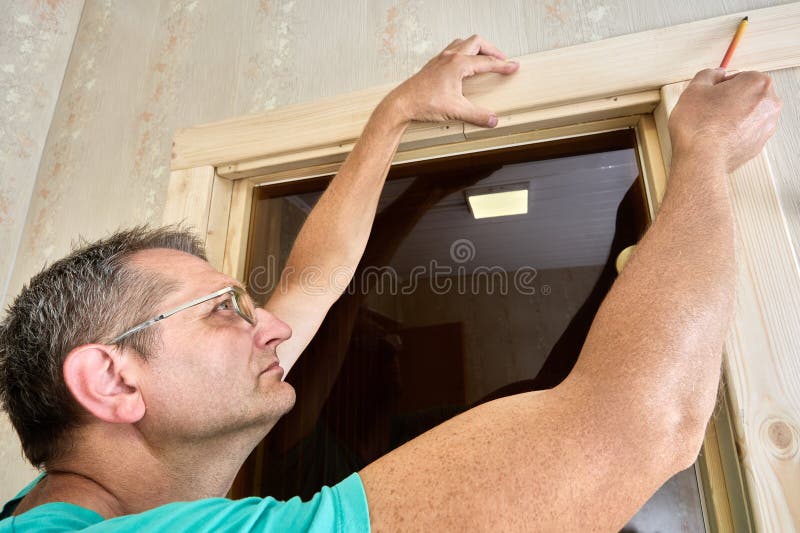 Creating Marking Door Frame Using Pencil and Piece of Trim Stock Photo ...