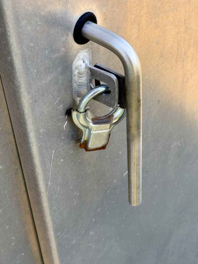 A Door Handle Secured with a Lock Stock Image - Image of gate, close ...