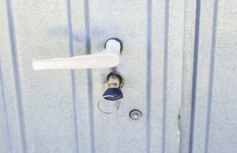 Door Handle and Built-in Lock, with Key, on Iron Door Stock Image ...