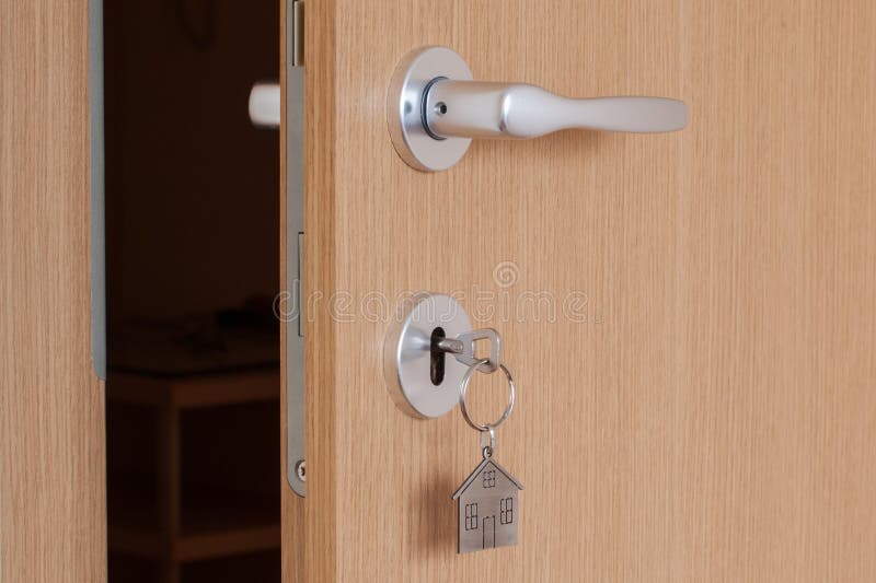 Door Handle with Inserted Key with House Icon Keyring Stock Photo ...
