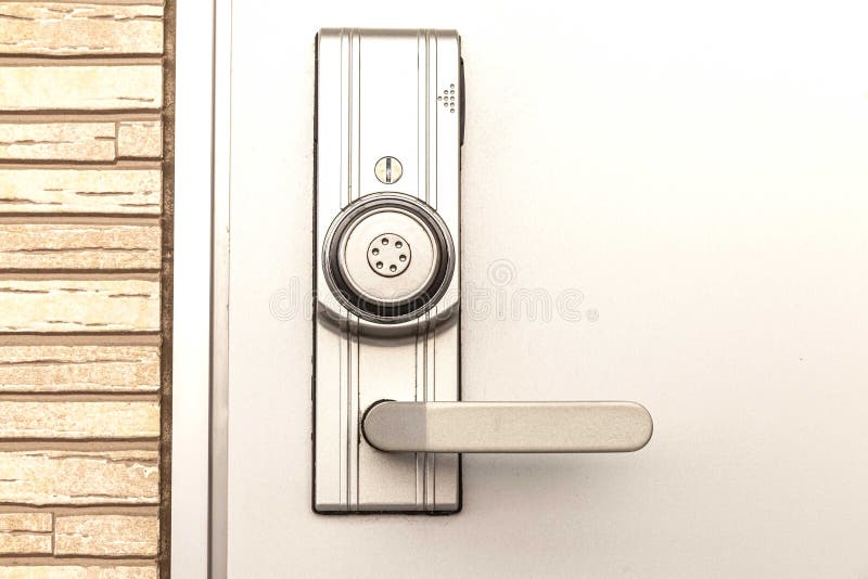 Door Handle with Security System Lock on Metal Door Stock Photo - Image ...