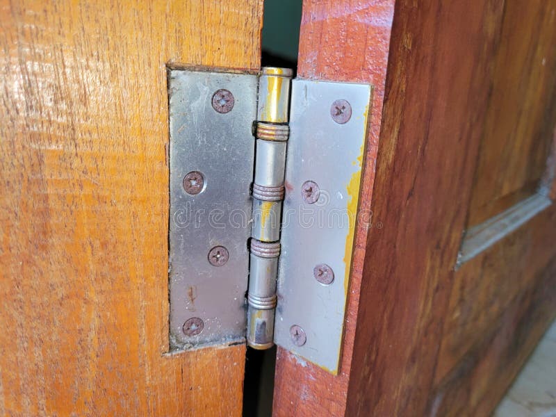 Door Hinges Made of Metal and Bolted To a Wooden Door and Wooden Frame ...