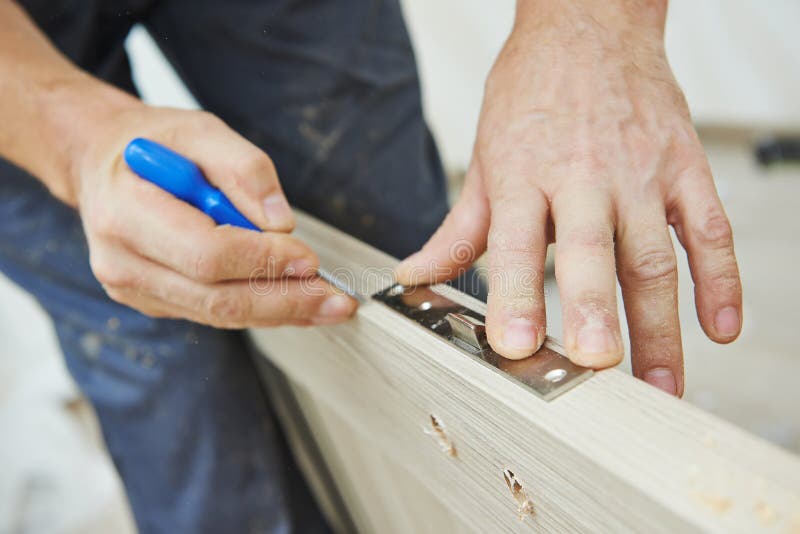 Door lock installation stock photo. Image of carpenter - 48536390