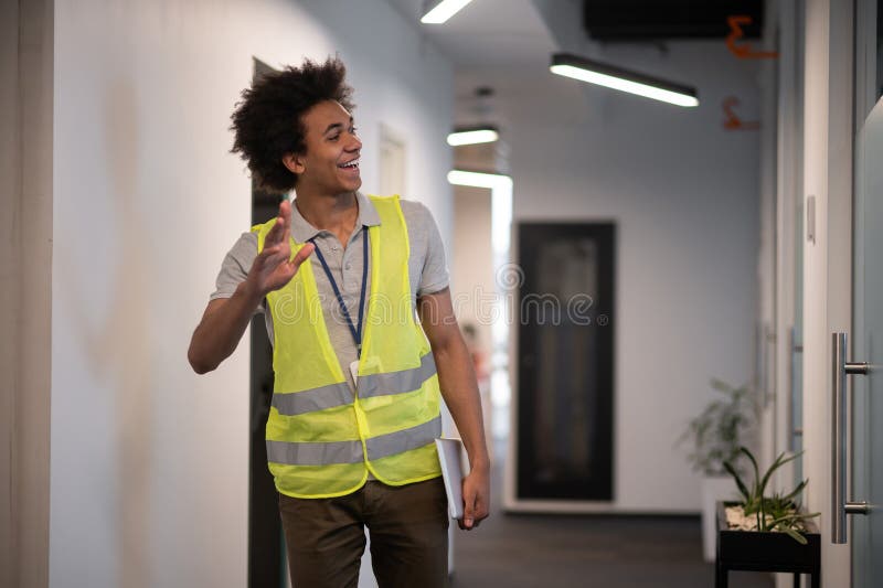 Dark-skinned Serviceman Checking the Office Doors Locker after Working ...