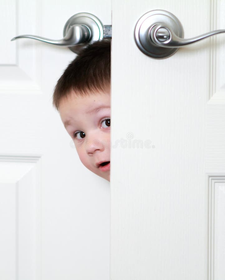Kid sneaking through door stock image. Image of secret - 16041909