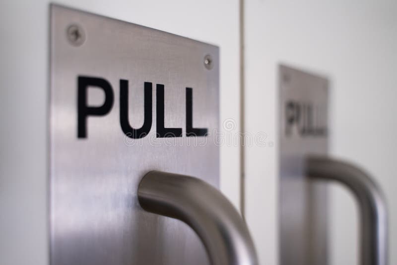 Door Pull Sign, Door Handle Affixed To the Glass Background of an ...