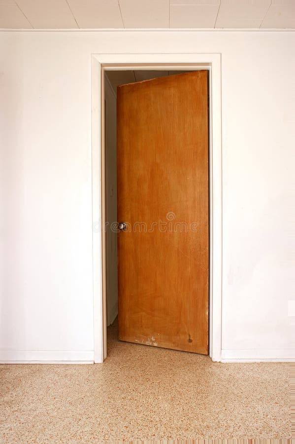 Door in White Wall Slightly Open Stock Image - Image of wood, floor ...