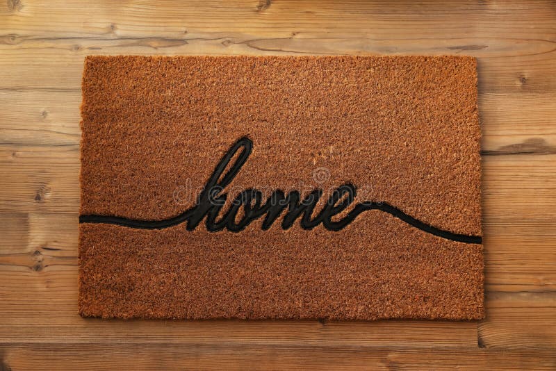 Doormat with Word Home on Parquet Floor, Top View Stock Photo - Image ...