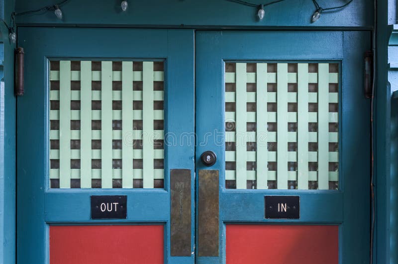 Doors Marked in and Out stock photo. Image of building - 86132662