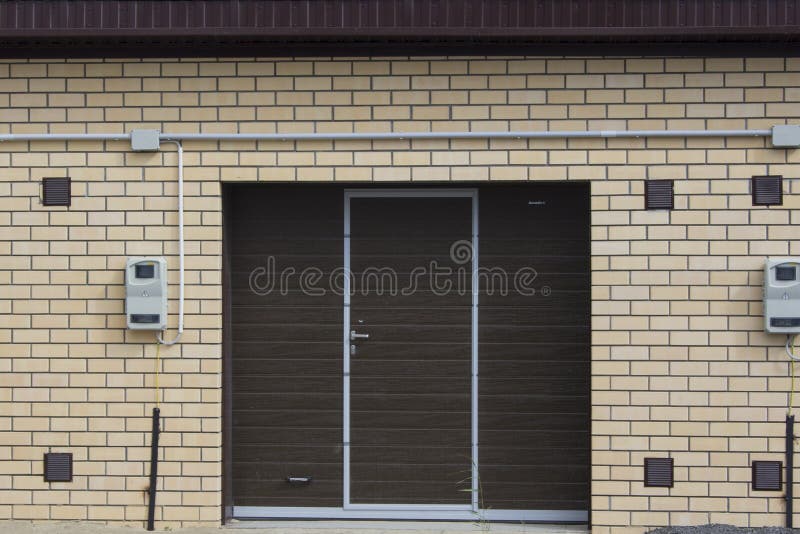 Doors of the New Garage Box Stock Image - Image of security, brick ...