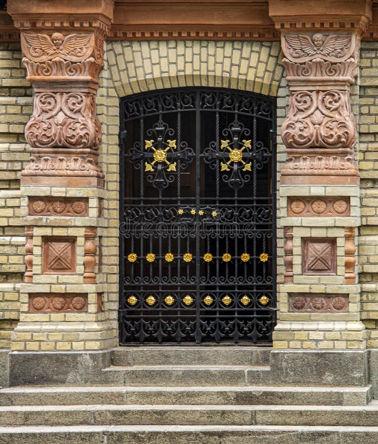 The Forged Doors in a Brick Wall Stock Image - Image of window, iron ...