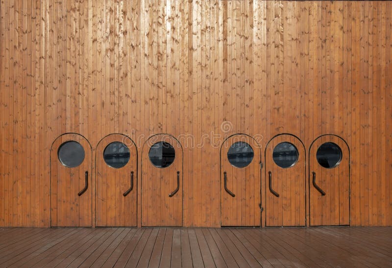 Doors with Round Windows Portholes in a Wooden High Wall on a Ship Deck ...