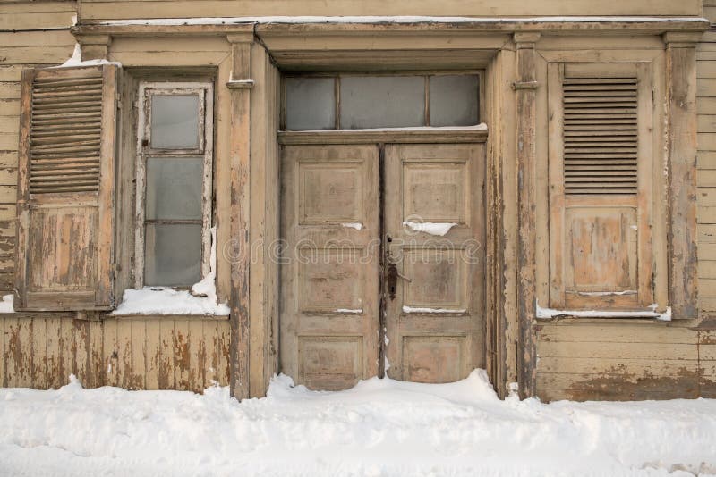 Doors and Windows of a Very Old House. Snow in Front of the House Stock ...