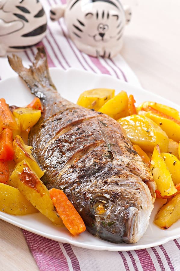 Dorada baked with potatoes stock photo. Image of gourmet - 38932286